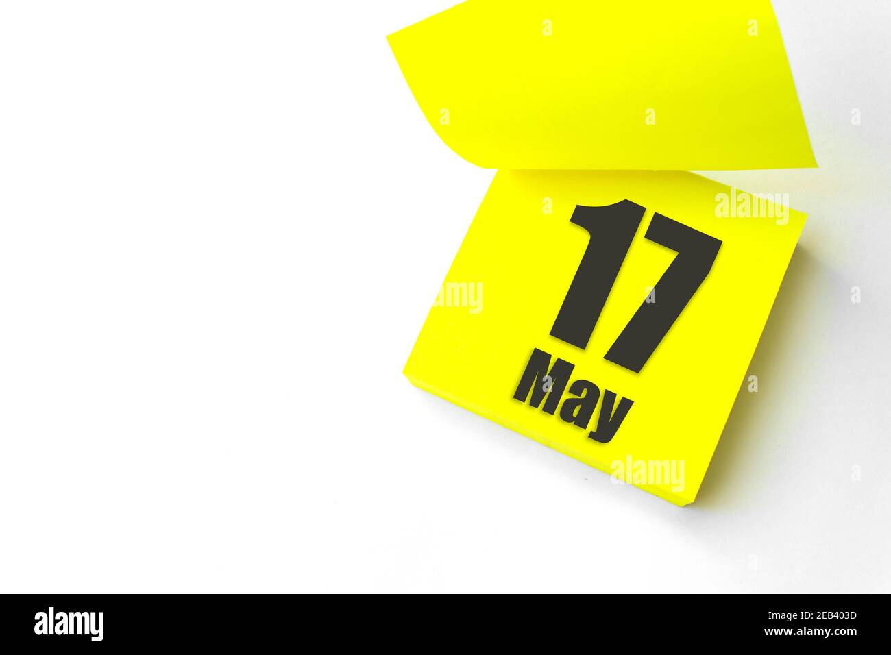 May 17th. Day 17 of month, Calendar date. Close-Up Blank Yellow paper ...