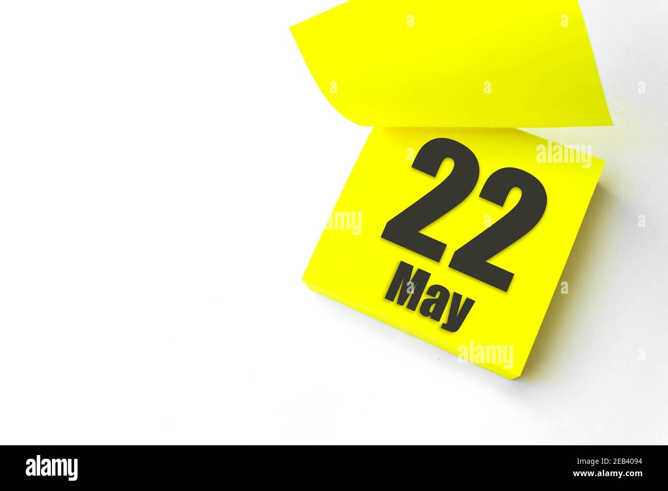May 22nd. Day 22 of month, Calendar date. Close-Up Blank Yellow paper ...