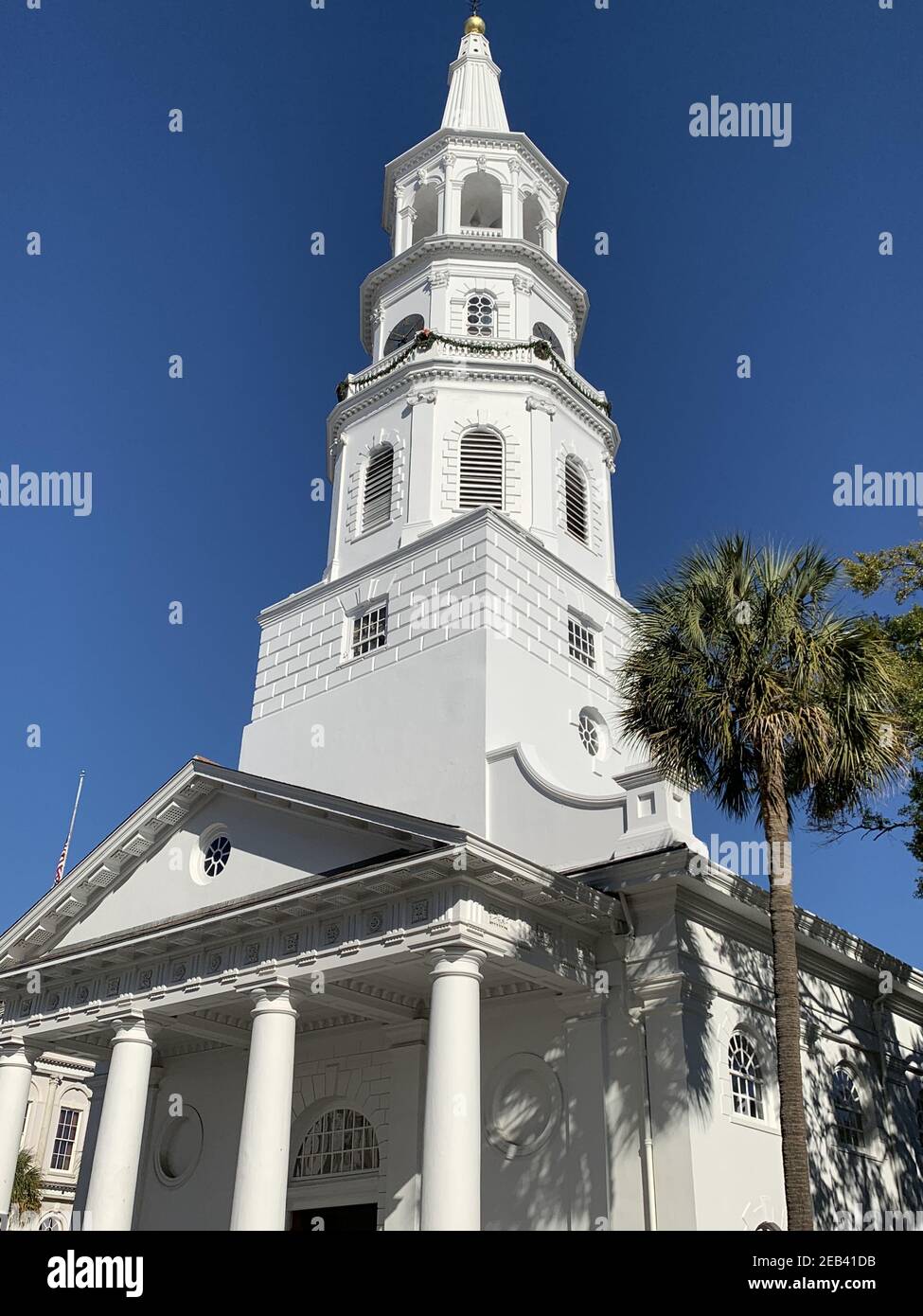 A vertical shot of the Charleston church saint Michael under a blue sky ...