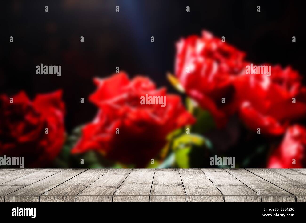 Empty top wooden table and flower blurred background. Can use for ...