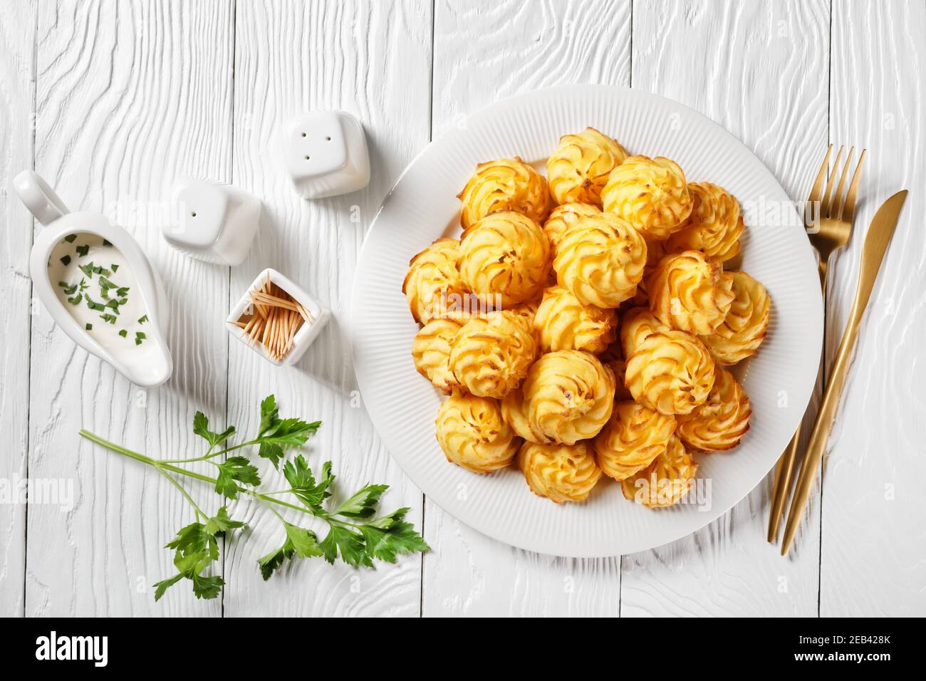 Duchess potatoes, mashed potatoes piped in decorative swirls, browned ...