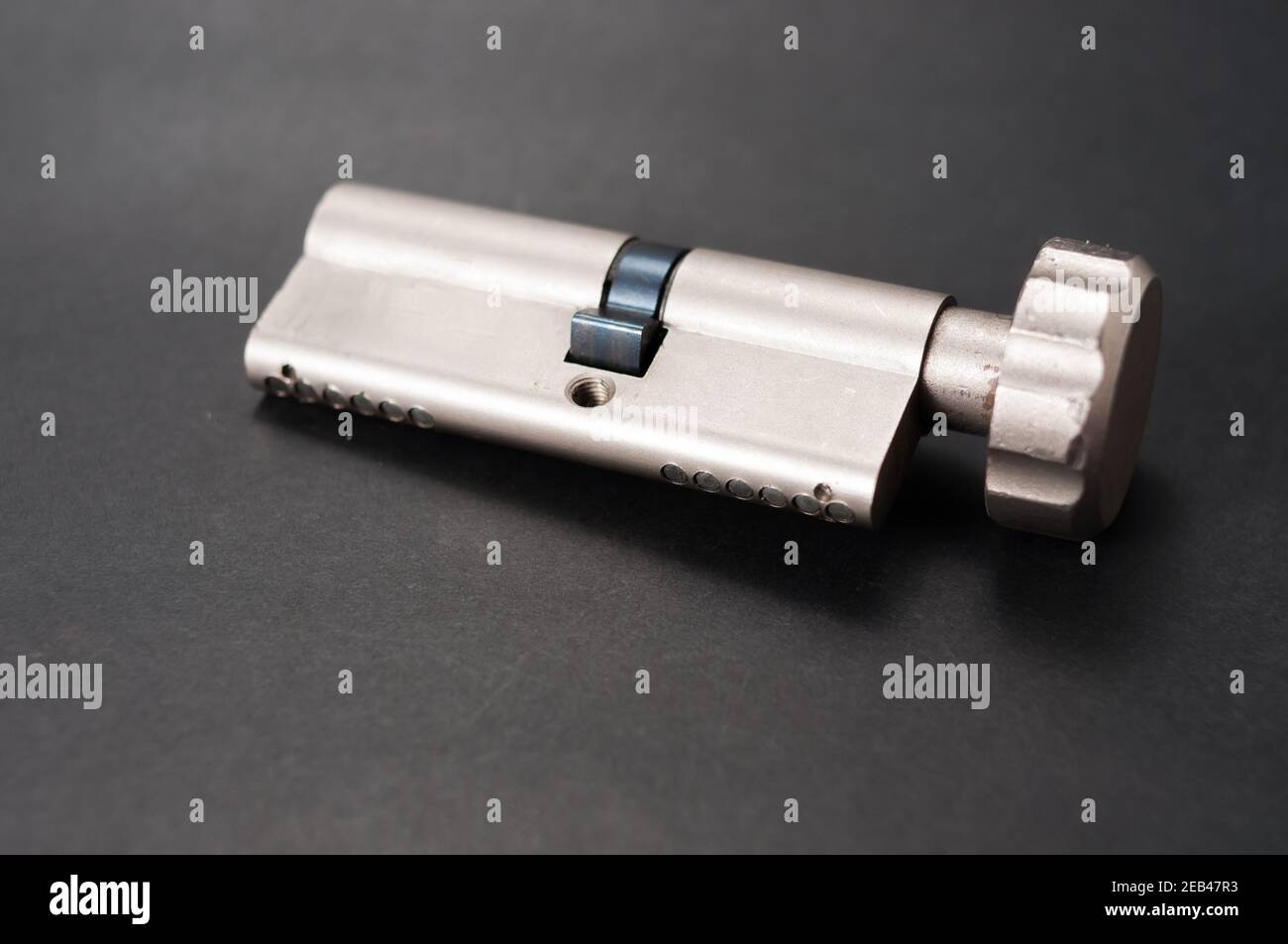 special cylinder lock with a knob, twist grip on one side. The ...