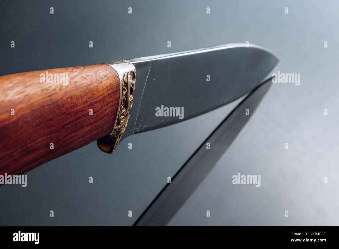 Hunting knife on black background with reflection Stock Photo - Alamy