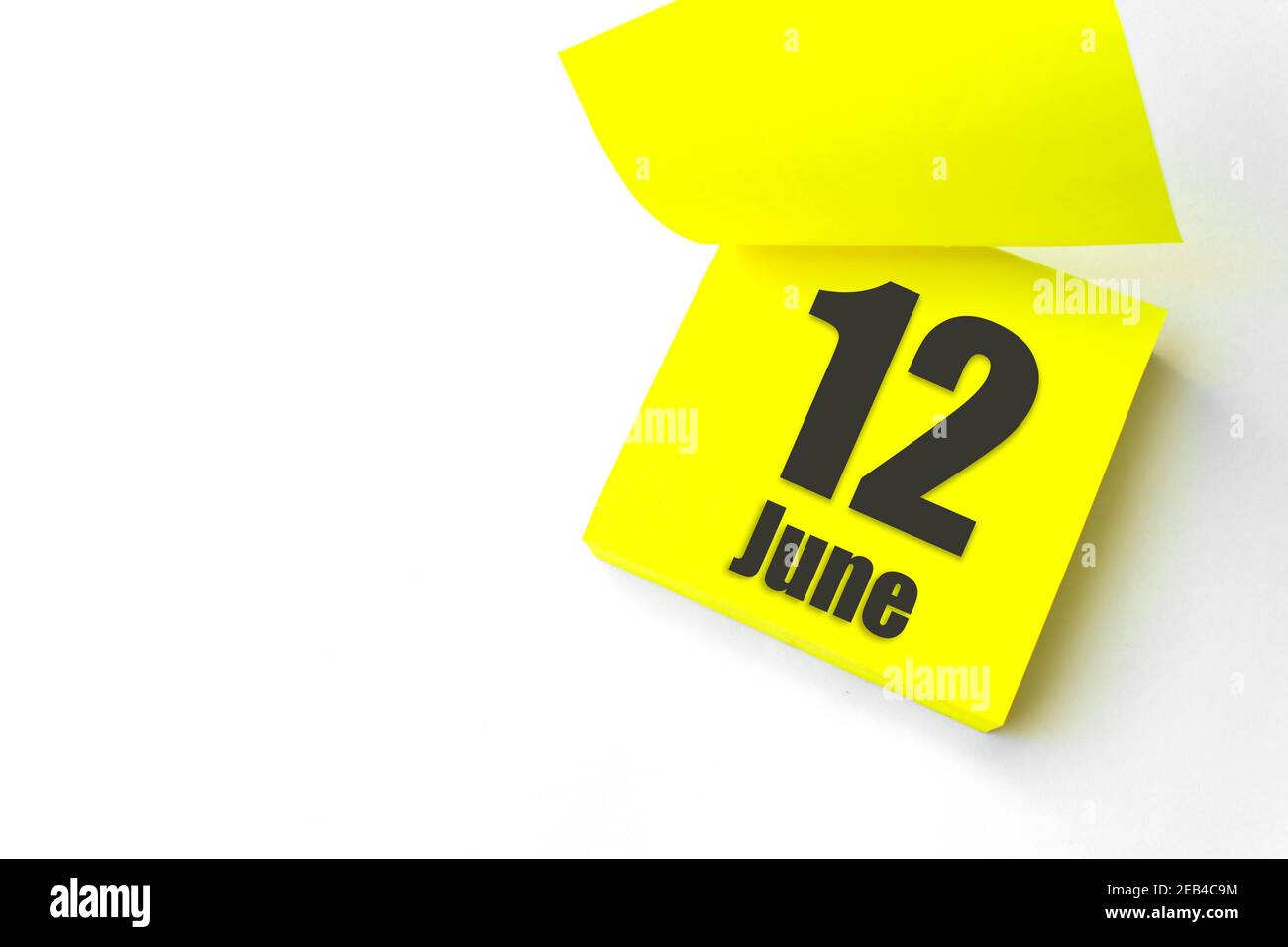 June 12nd. Day 12 of month, Calendar date. Close-Up Blank Yellow paper ...