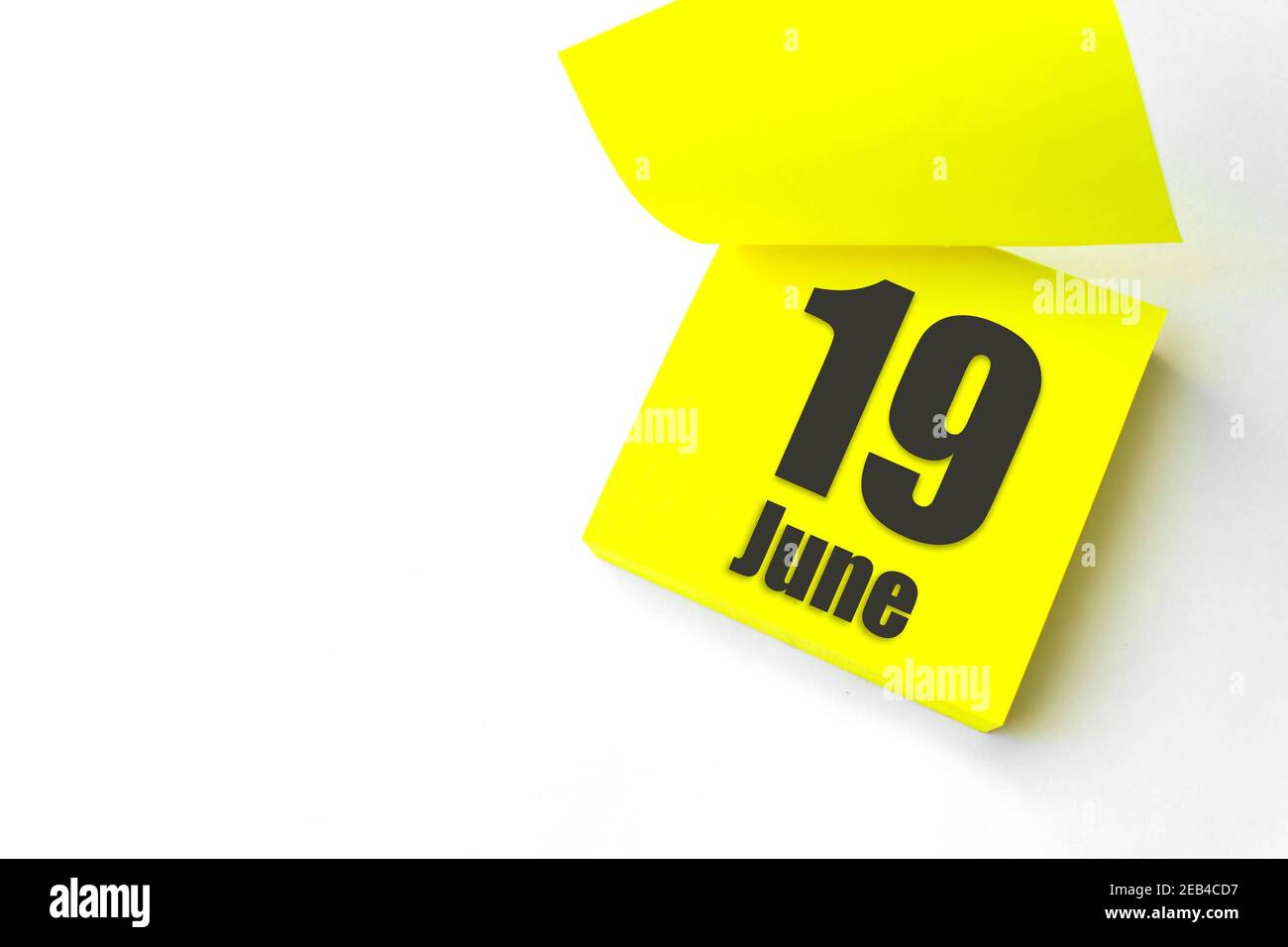 June 19th. Day 19 of month, Calendar date. Close-Up Blank Yellow paper ...
