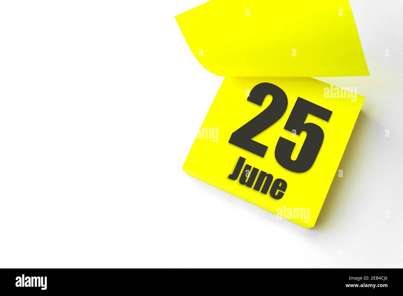 June 25th. Day 25 of month, Calendar date. Close-Up Blank Yellow paper ...