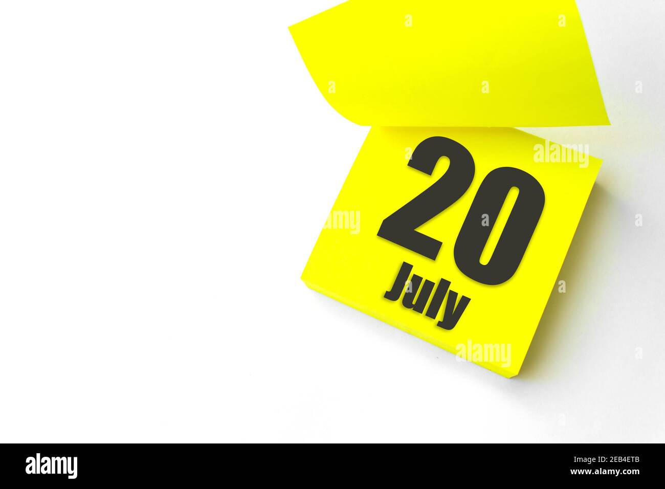 July 20th. Day 20 of month, Calendar date. Close-Up Blank Yellow paper ...