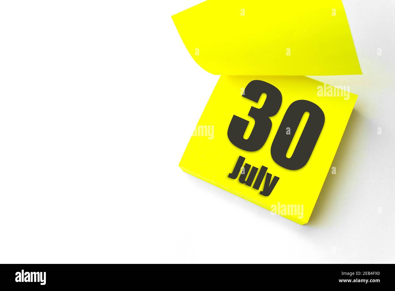 July 30th. Day 30 of month, Calendar date. Close-Up Blank Yellow paper ...