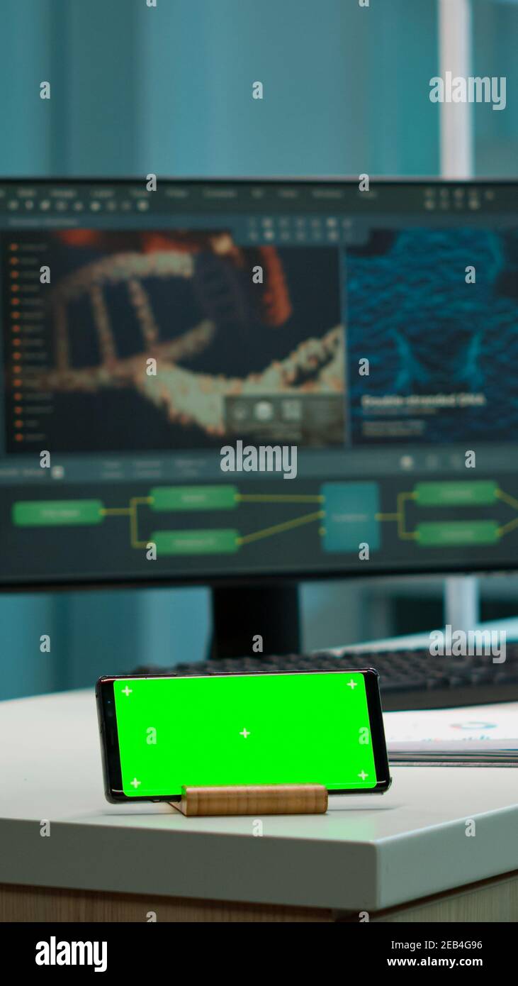 Scientist standing at monitor in background analysing virus evolution ...