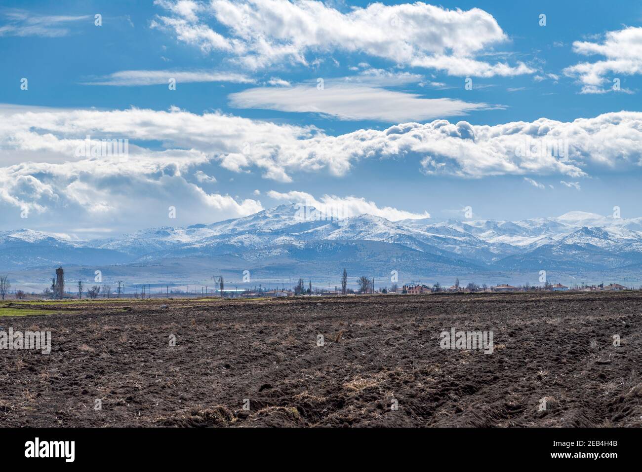 Elhan village and snow-capped emirdag mountains in background. Emirdag ...