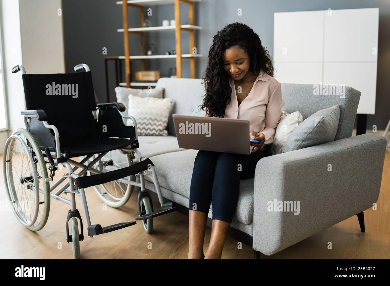 African Woman At Home Using Computer For Video Conference Stock Photo ...
