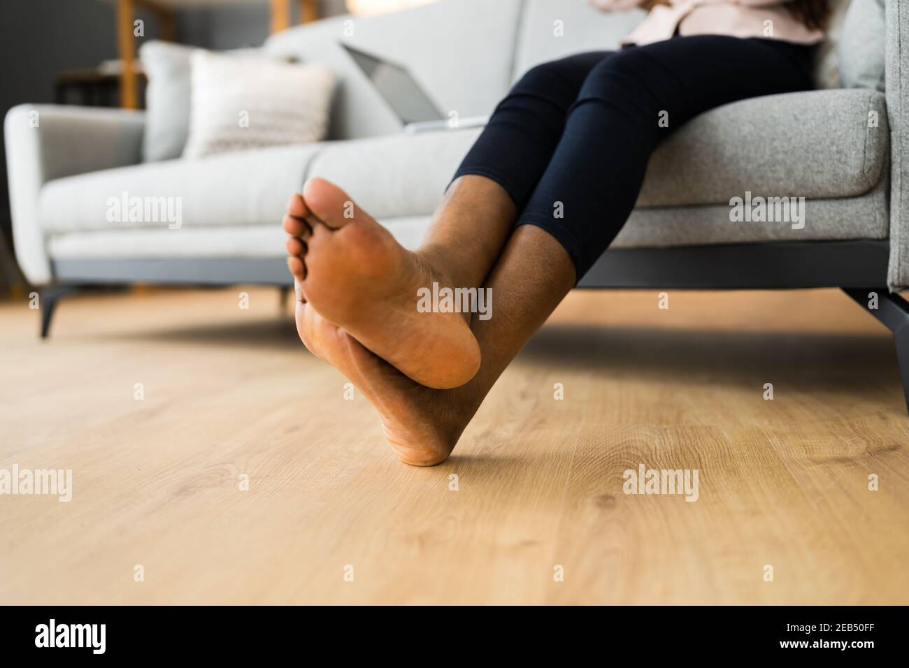 American African Barefoot Woman Legs On Heated Floor Stock Photo - Alamy