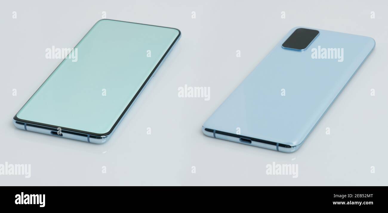 Smartphone lay on white surface back and forward view isolated Stock ...