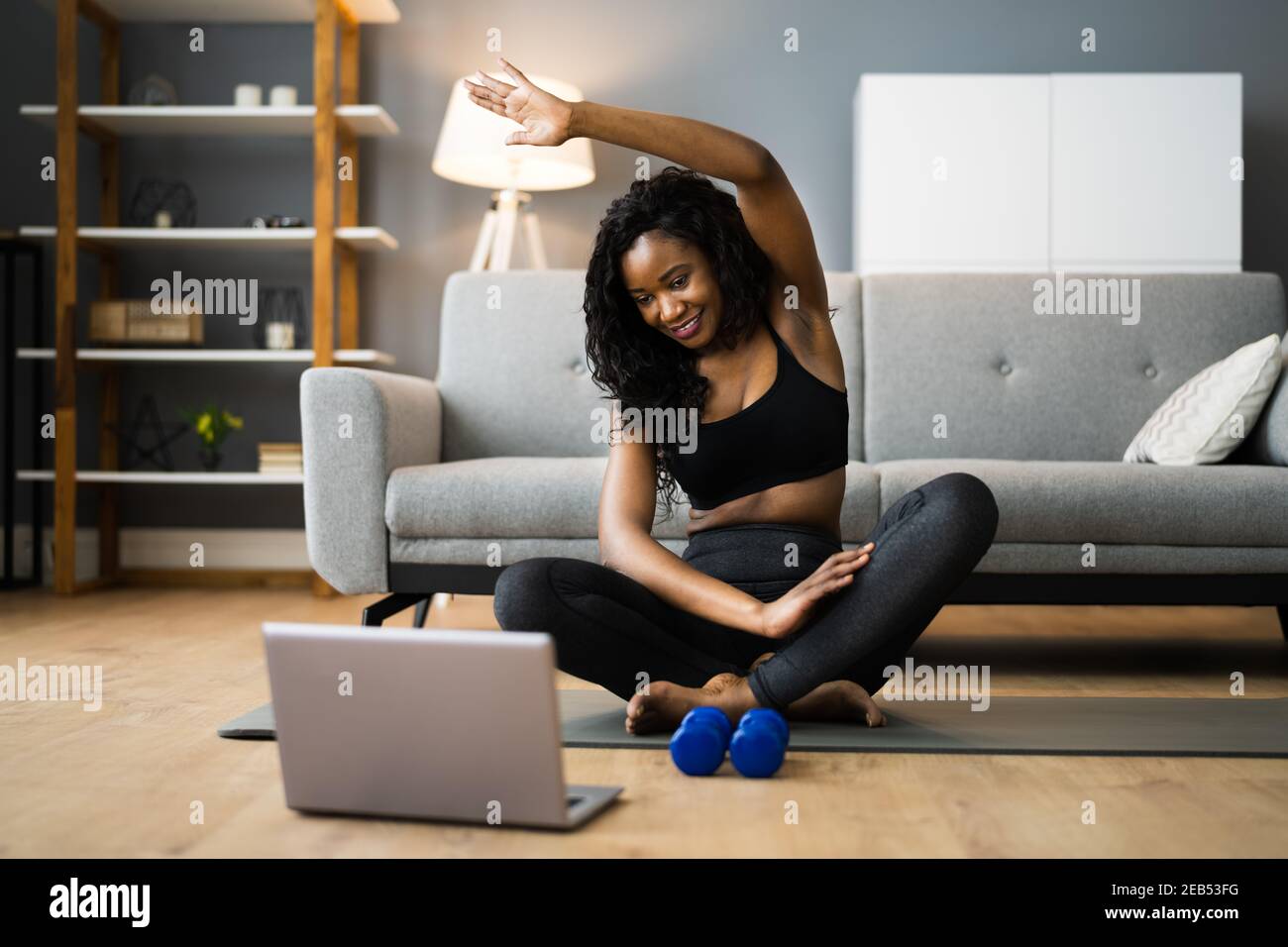 Online Laptop Home Fitness Workout And Exercise Stock Photo - Alamy