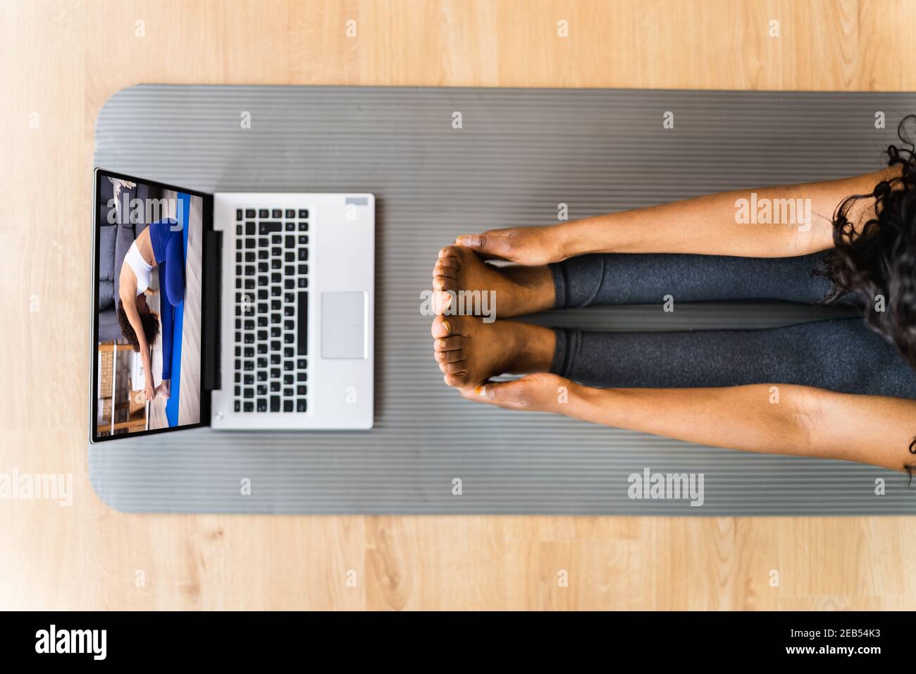 Online Laptop Home Fitness Workout And Exercise Stock Photo - Alamy