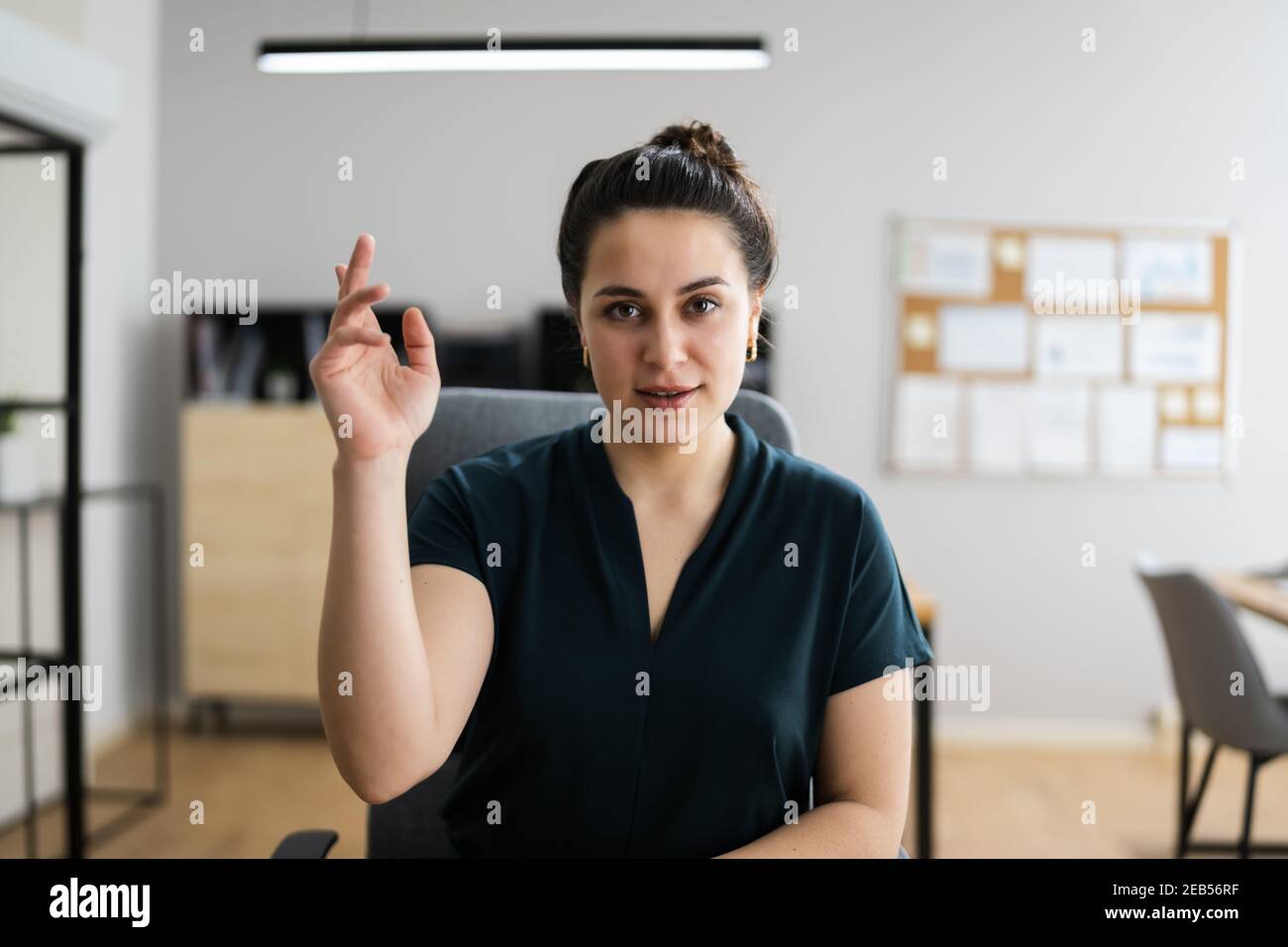 Raising Hand Asking Question In Video Conference Call Stock Photo - Alamy