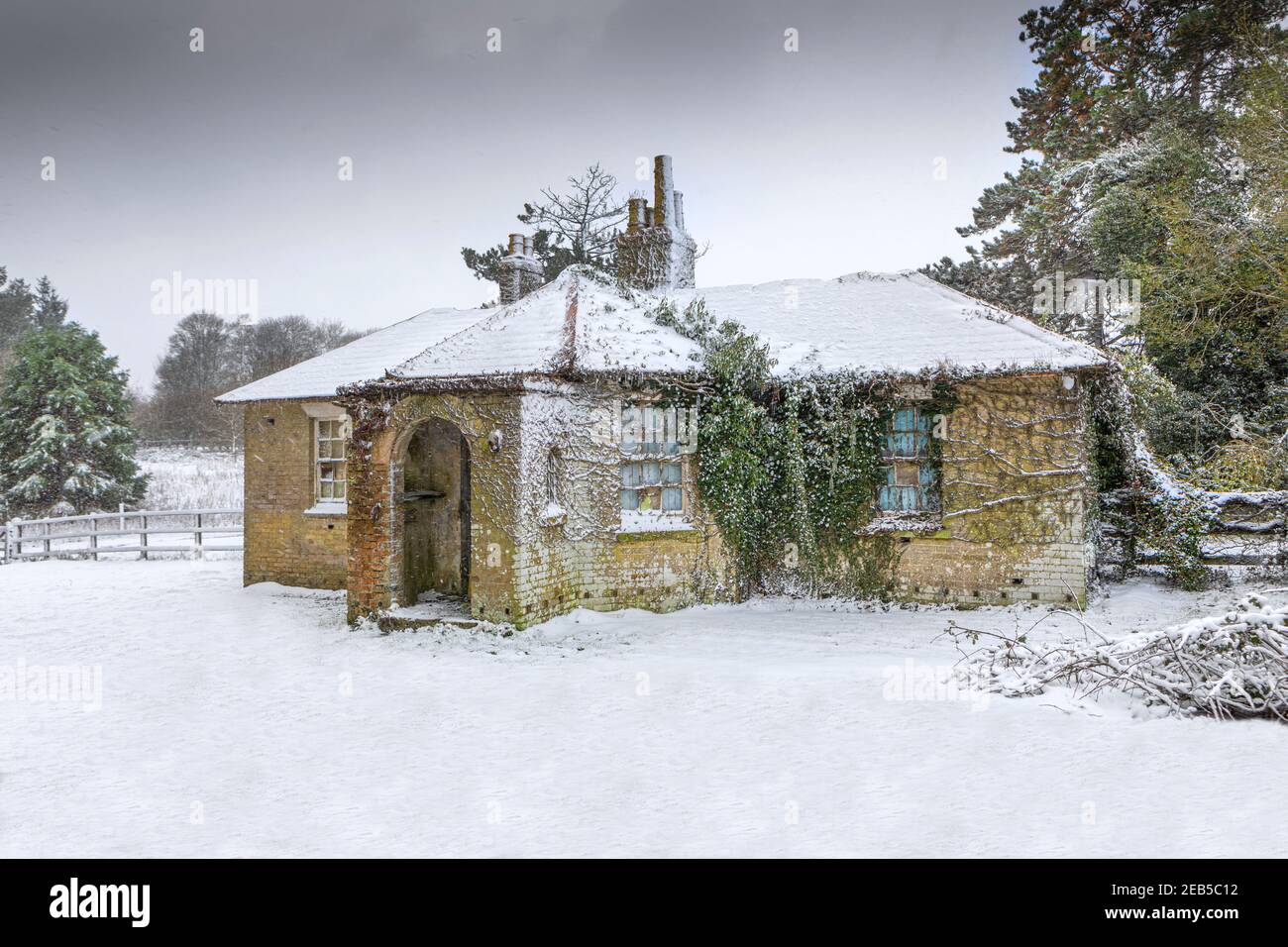 A small rural cottage covered in snow Stock Photo - Alamy