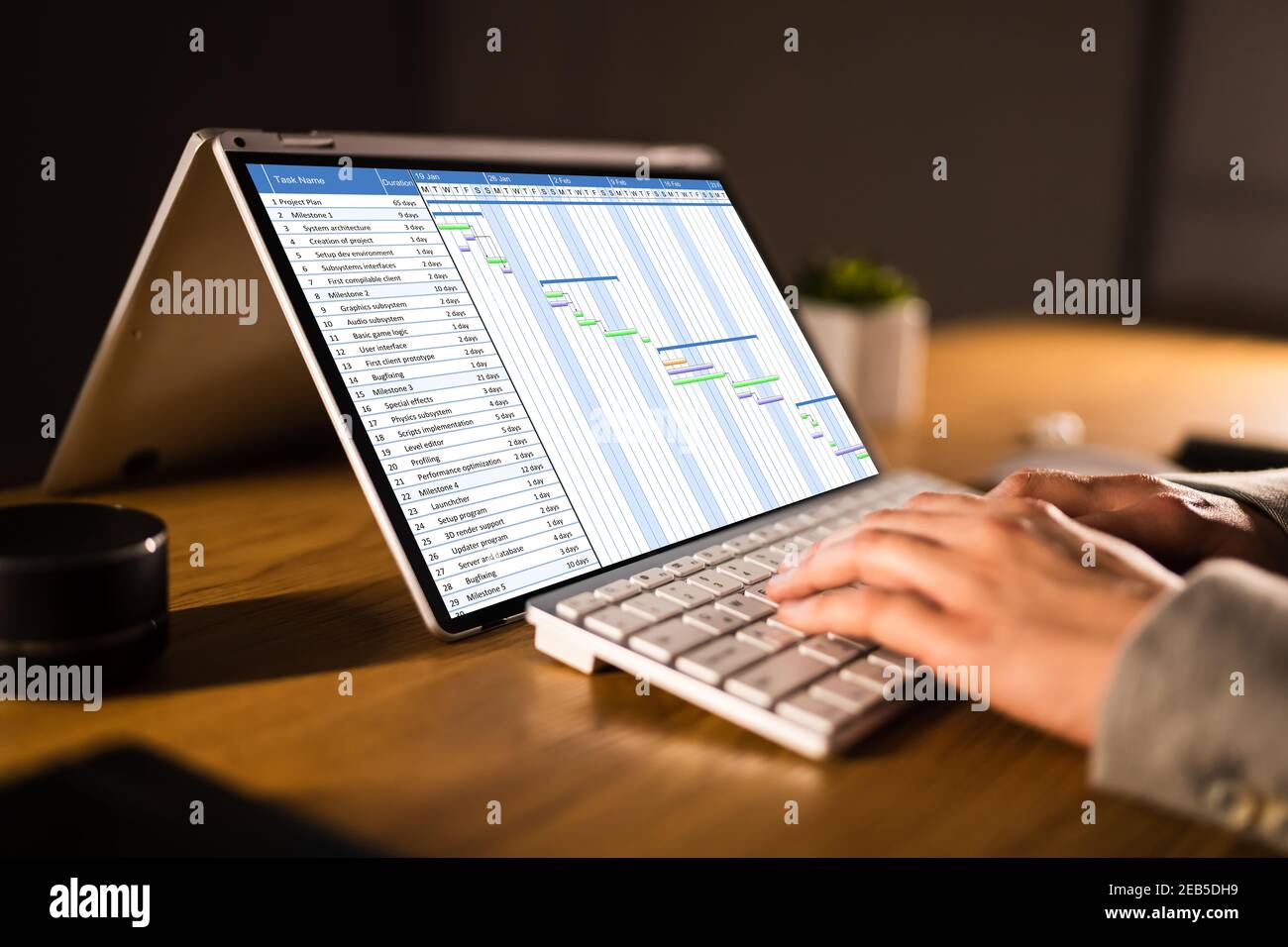 Employee Looking Calendar Schedule On Computer Screen Stock Photo - Alamy