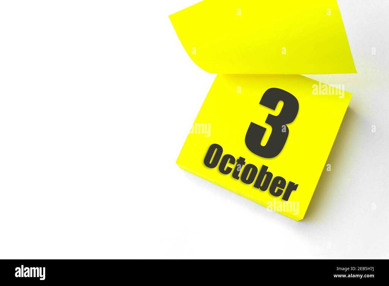 October 3rd. Day 3 of month, Calendar date. Close-Up Blank Yellow paper ...