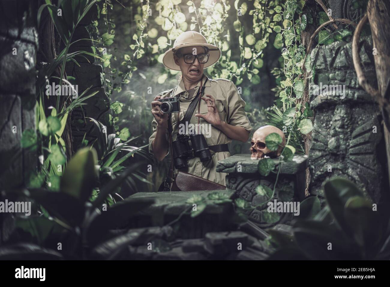 Scared explorer walking in the jungle and finding a human skull, she is ...