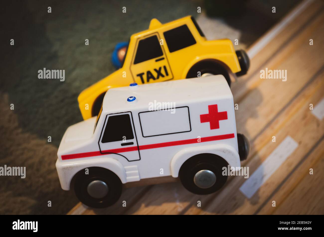 Toy taxi and ambulance vehicle Stock Photo - Alamy