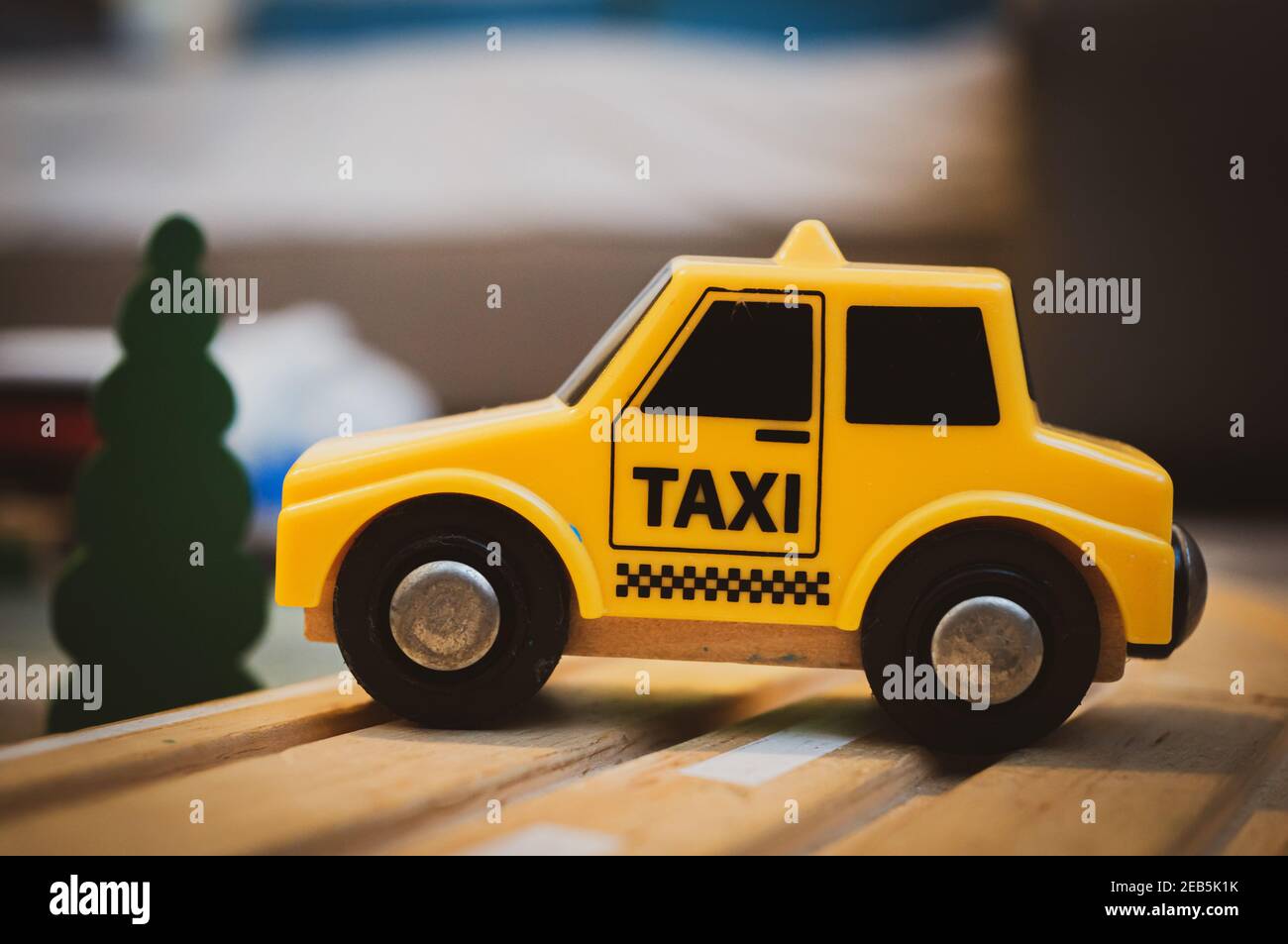 Yellow plastic toy taxi Stock Photo - Alamy