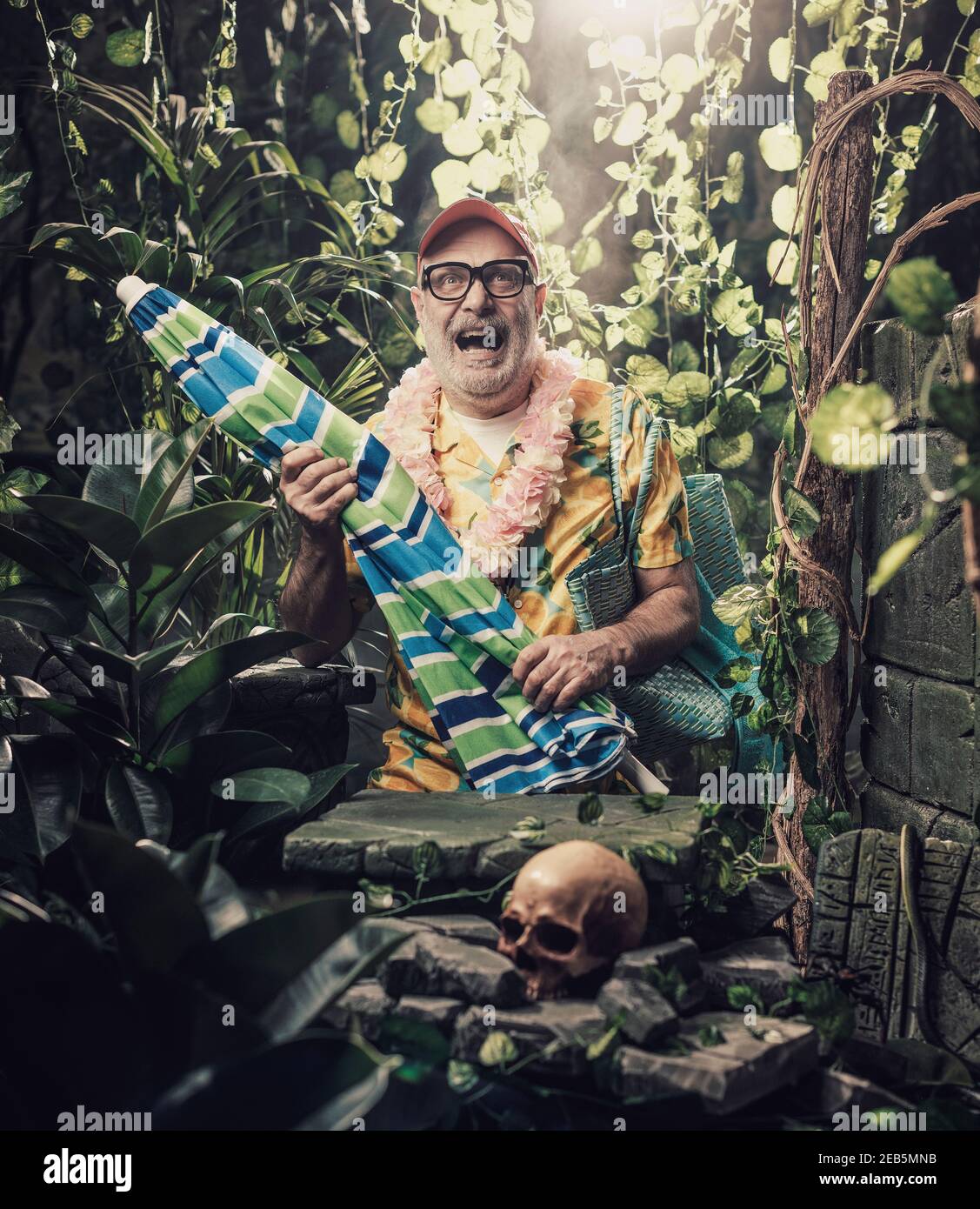 Unhappy scared tourist carrying a beach umbrella in the forest, he ...