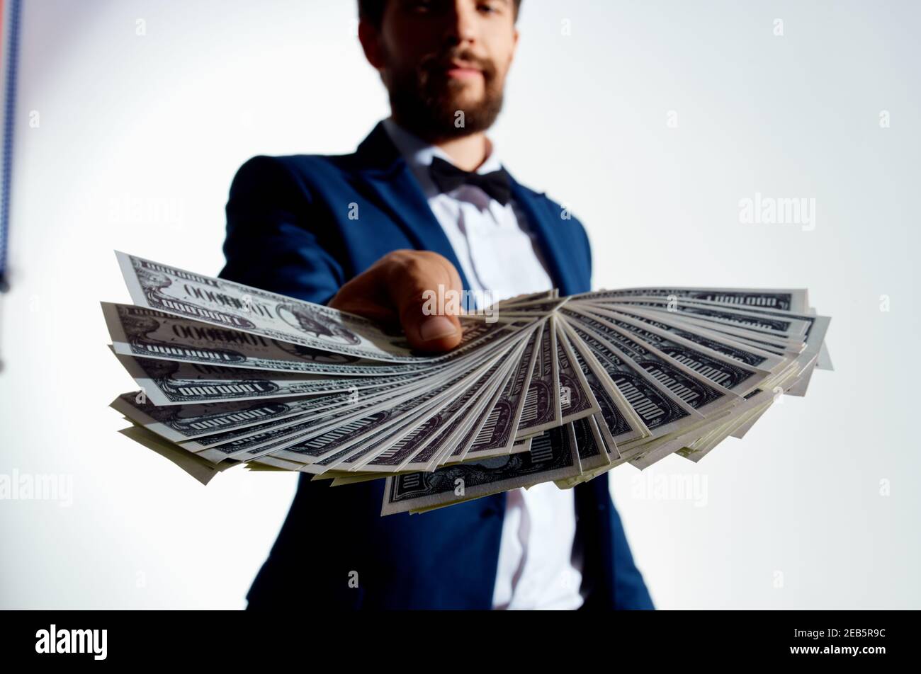 rich guy with a stack of bills money classic suit gesturing with his ...