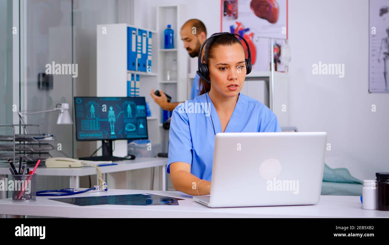 Female physician in headset consulting hi-res stock photography and ...