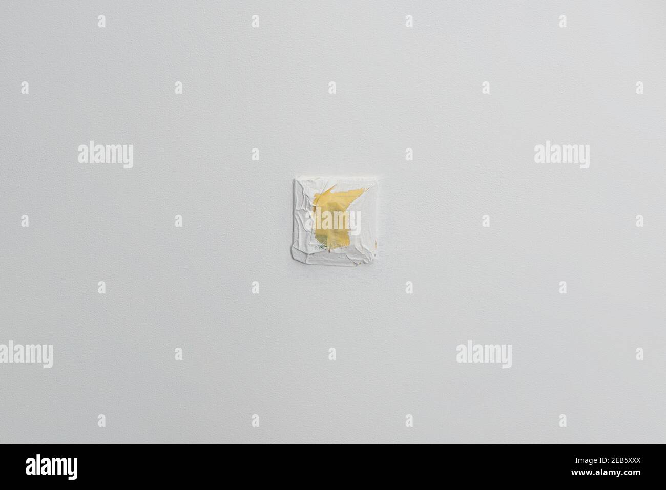 Power socket covered with masking tape while the white wall being ...