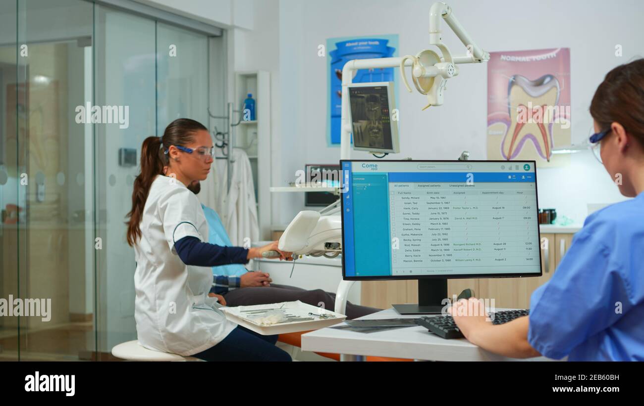 Assistant making appointments dentistry doctor hi-res stock photography ...