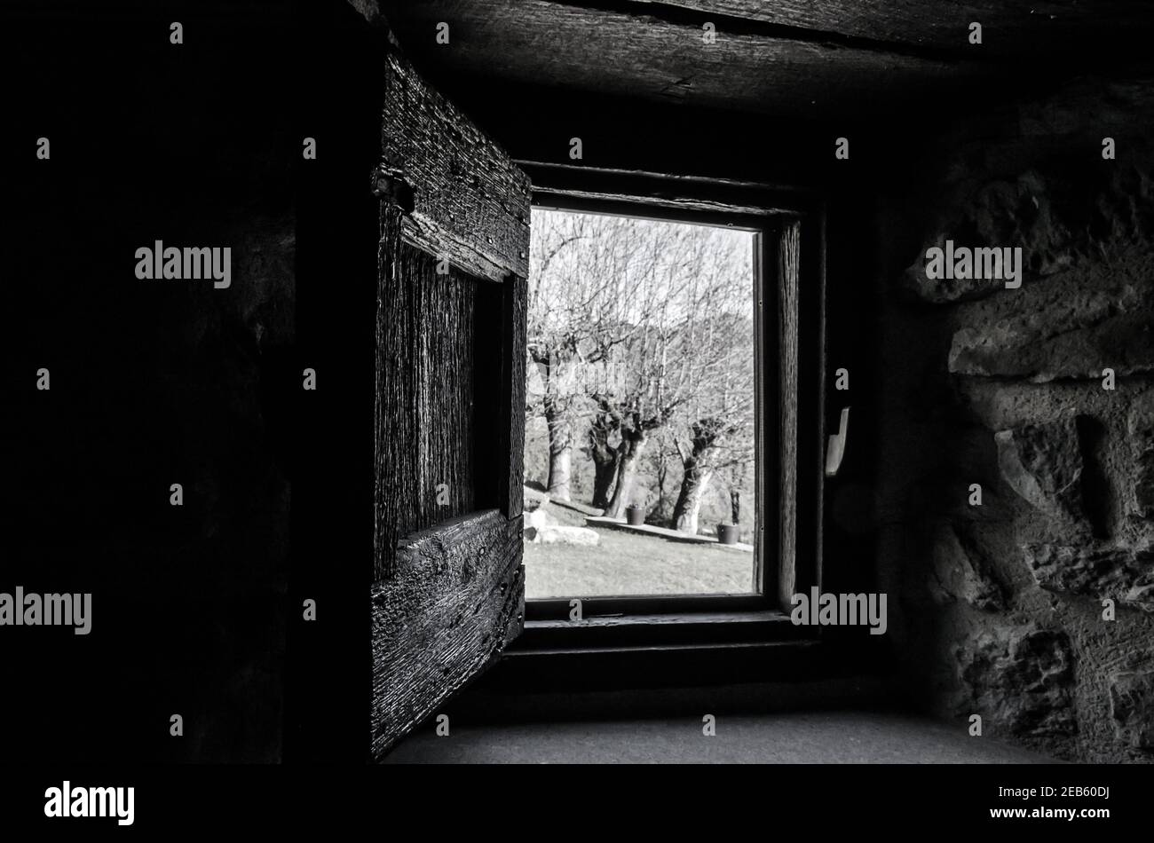Interior view from the window of a rustic house towards a beautiful ...