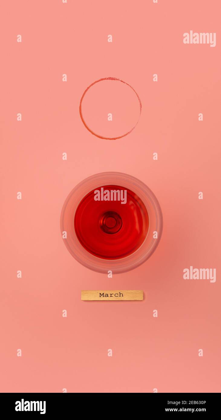 Top view of glass of red wine and glass stain in shape of number 8 ...