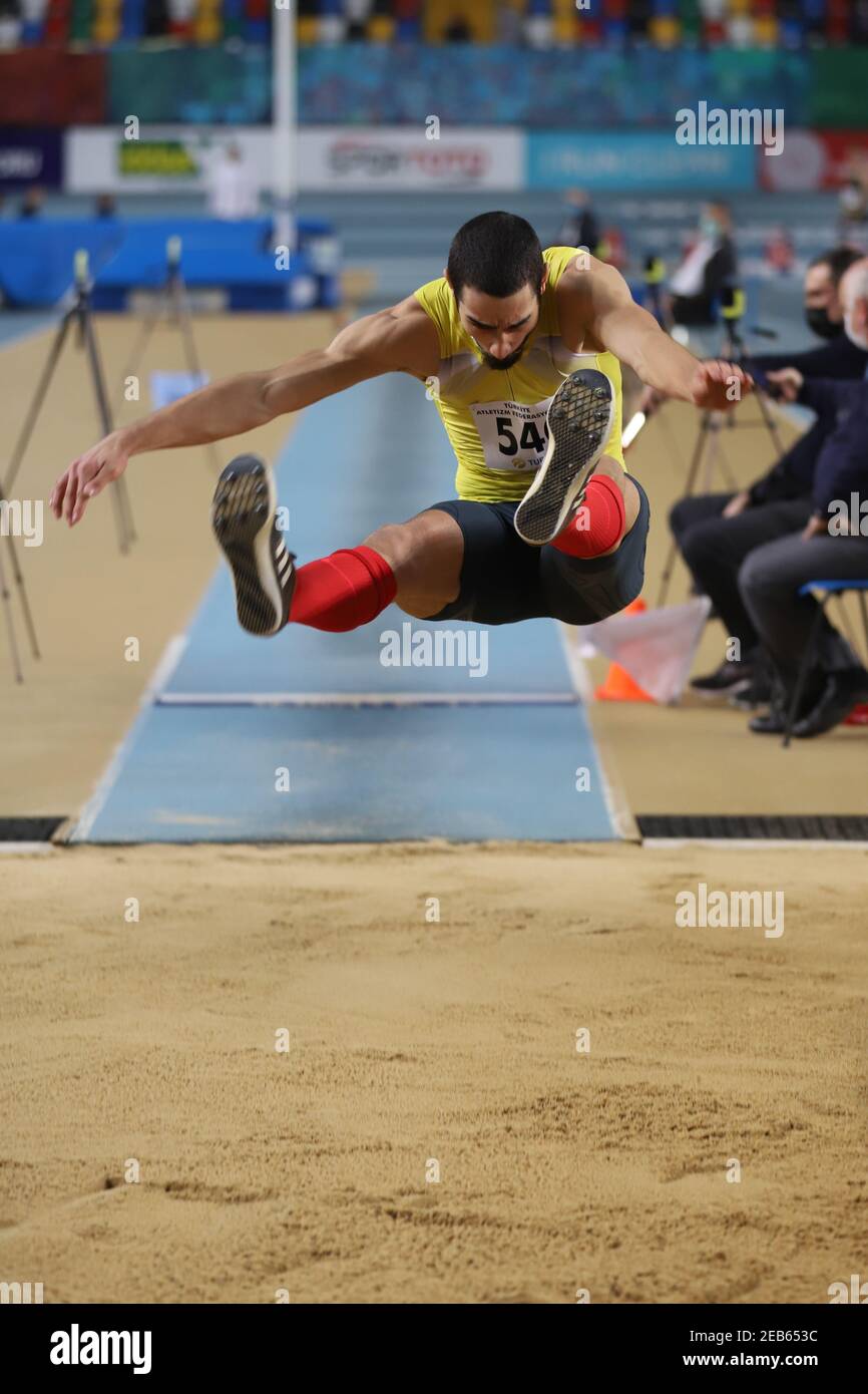 ISTANBUL, TURKEY - FEBRUARY 06, 2021: Undefined athlete long jumping ...