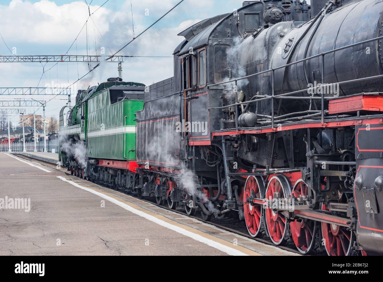 Electric and steam trains depart from the station. Moscow. Russia Stock ...