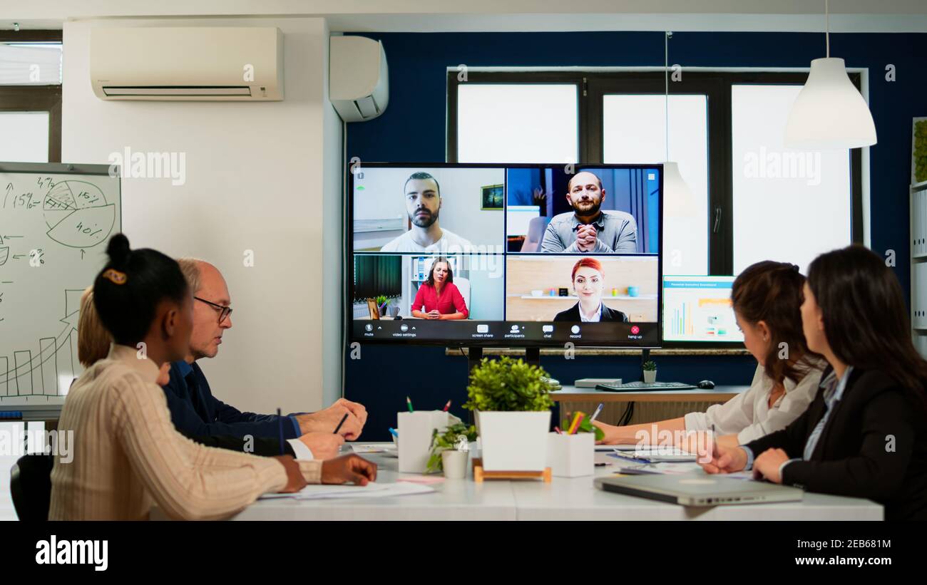 Team working by group video call share ideas brainstorming negotiating ...