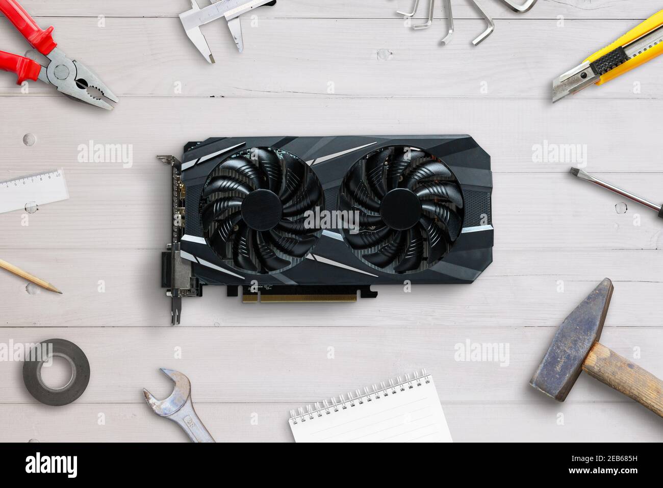 Graphic card service concept. Computer component on desk surrounded ...