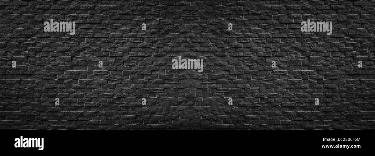 Panorama Black stone brick wall texture for design in dark background ...