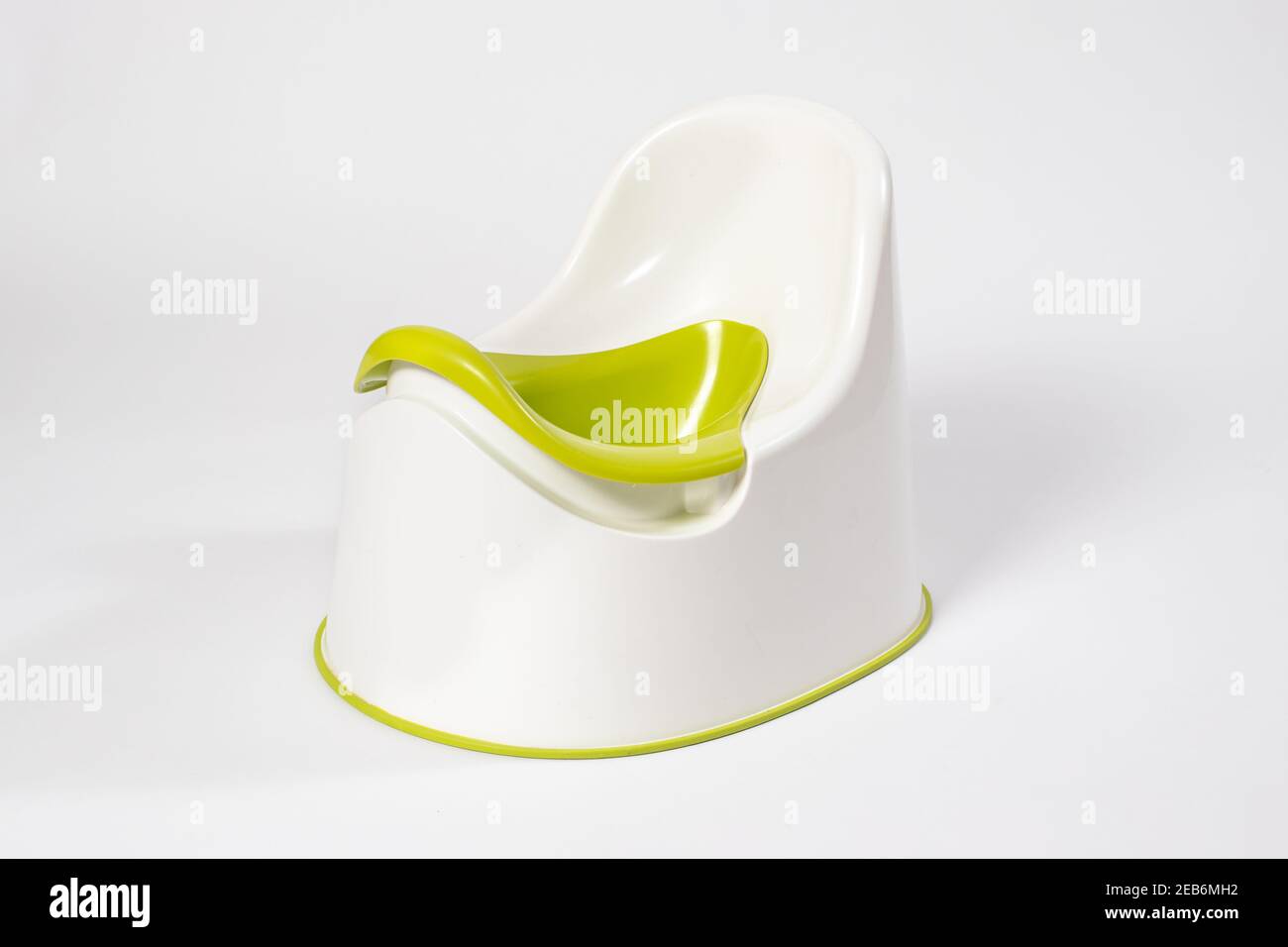 Children's pot is white-green on a white background. Teaching a child ...