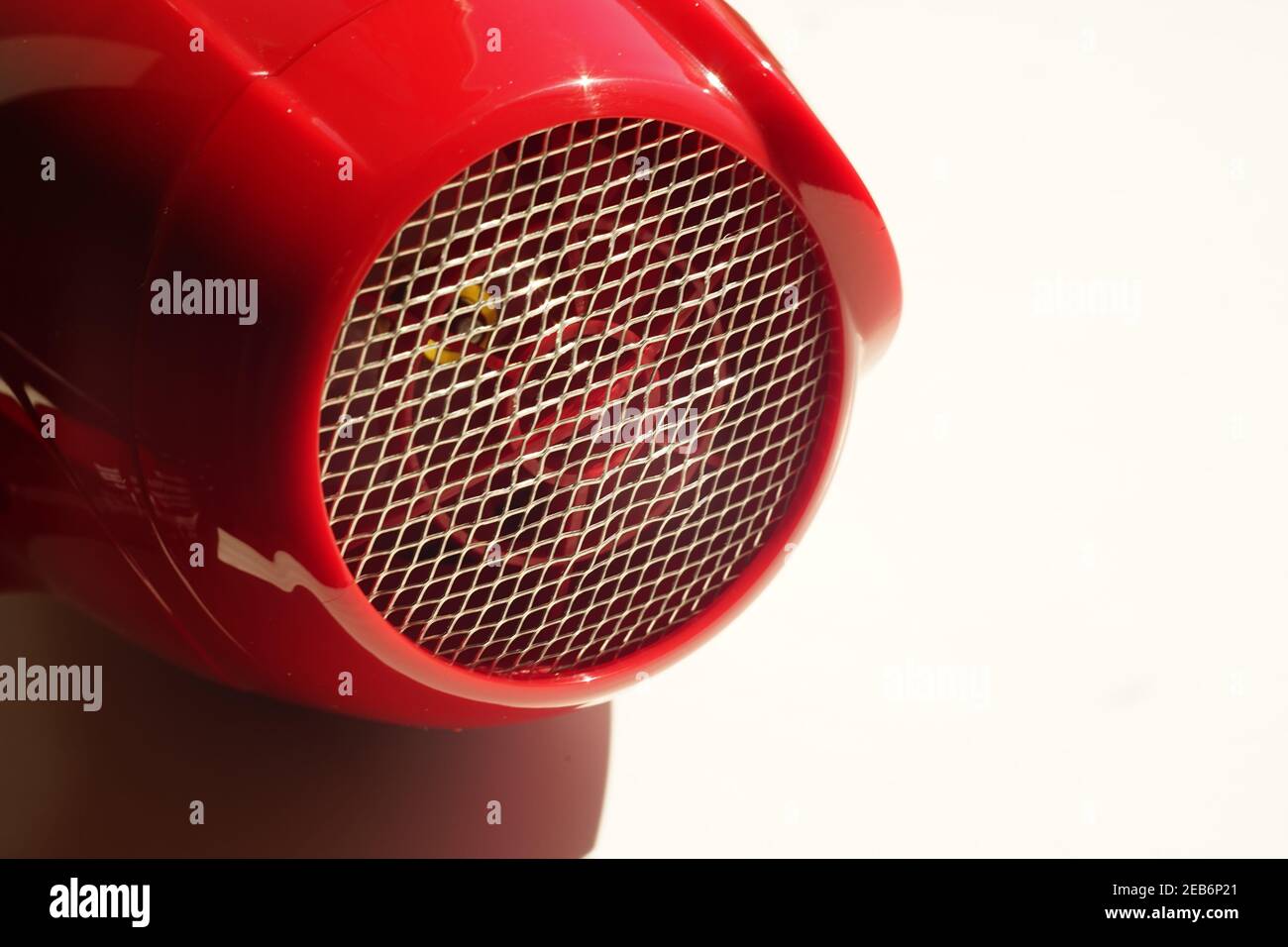 new red hair dryer, rear view on metal mesh Stock Photo - Alamy