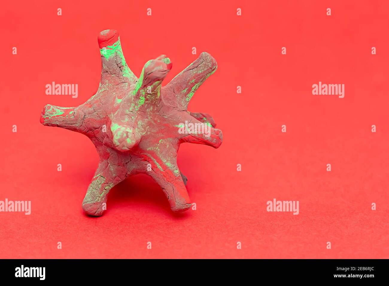 Coronavirus model made with red and green modeling clay. Isolated on ...