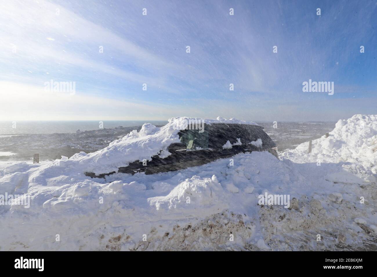 A Range Rover is buried under snow on Crete Road in Folkestone, Kent ...