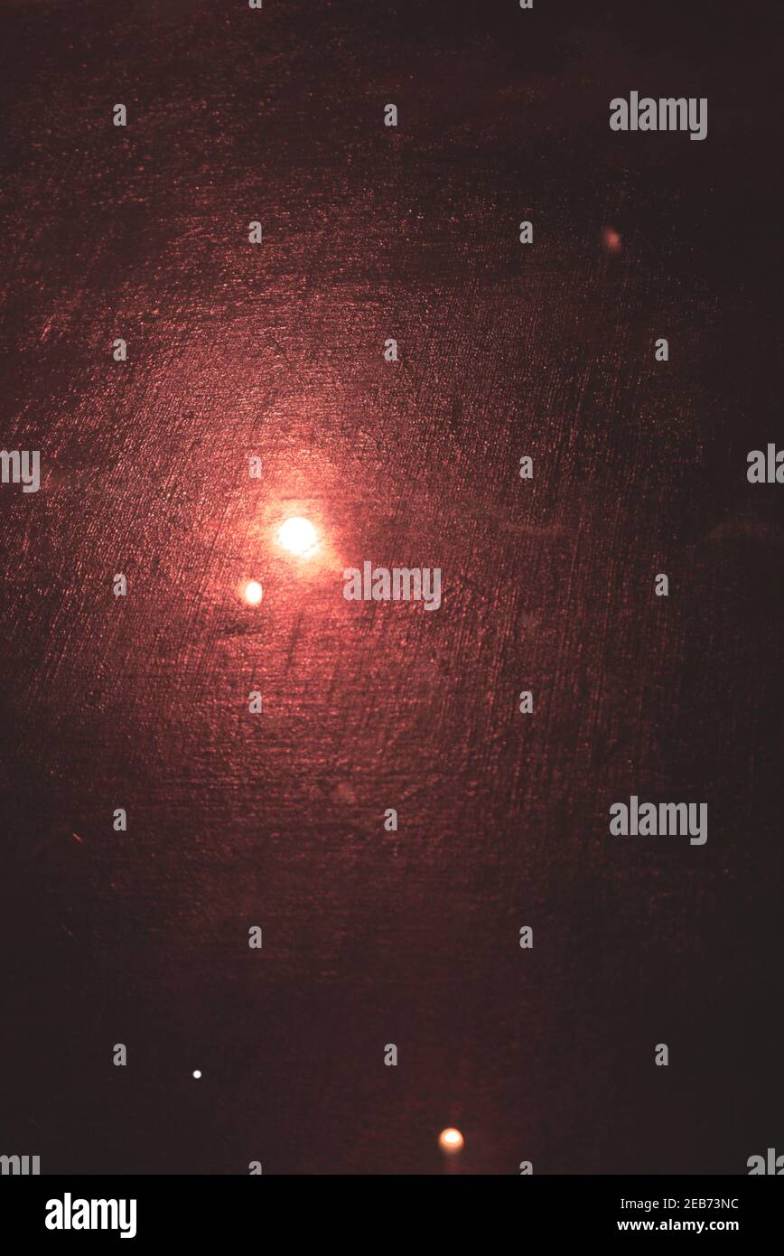 A light on a dark red surface creates a concept of disorientation Stock ...