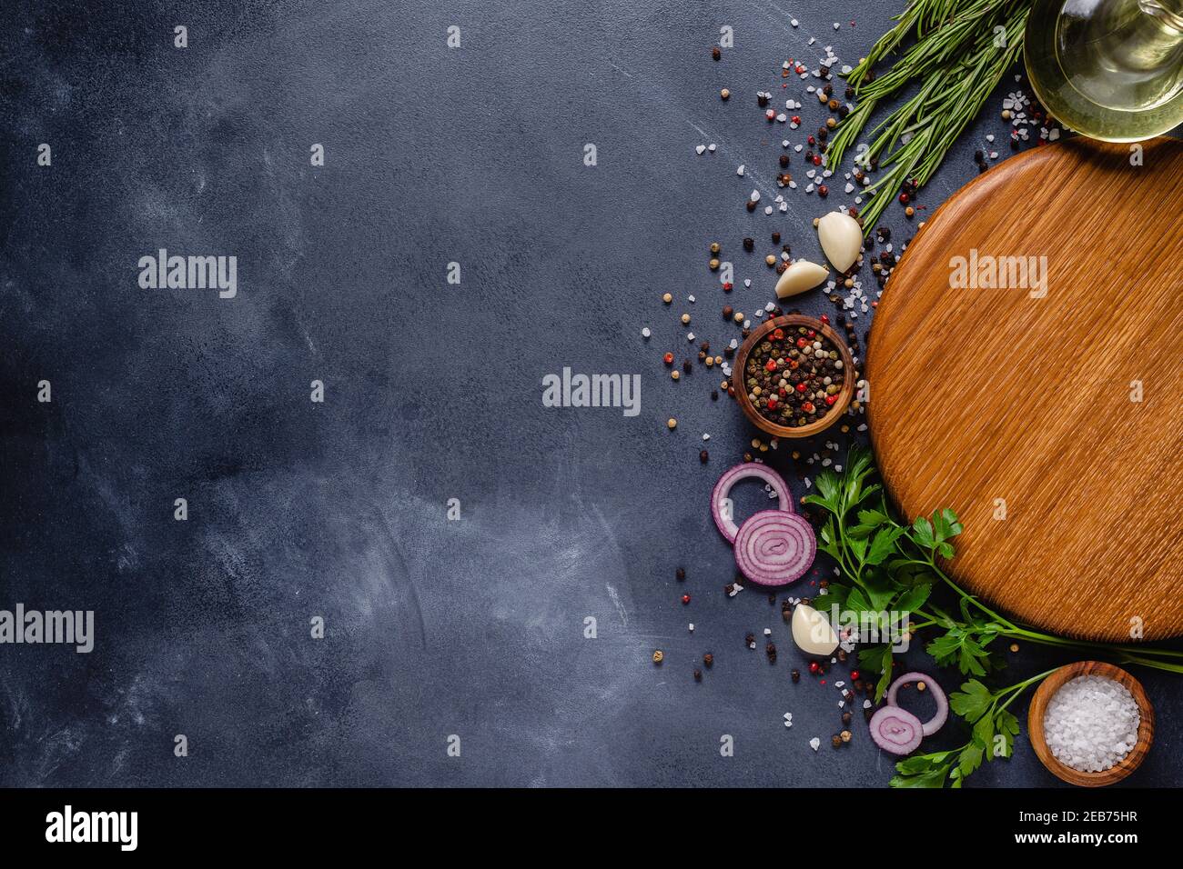 Herbs and condiments on black stone background. Top view with copy ...