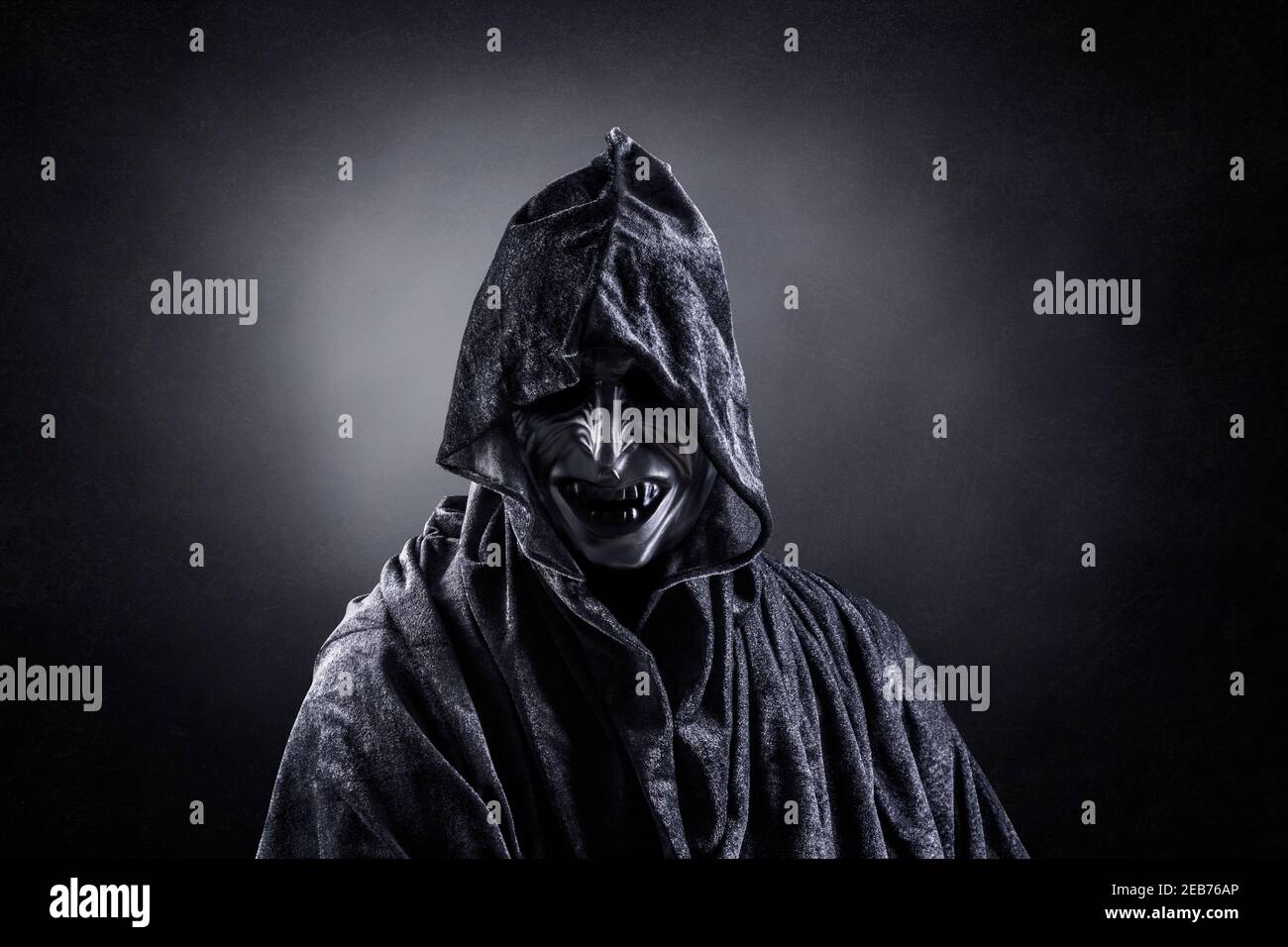 Angry vampire with cape showing his scary teeth Stock Photo - Alamy