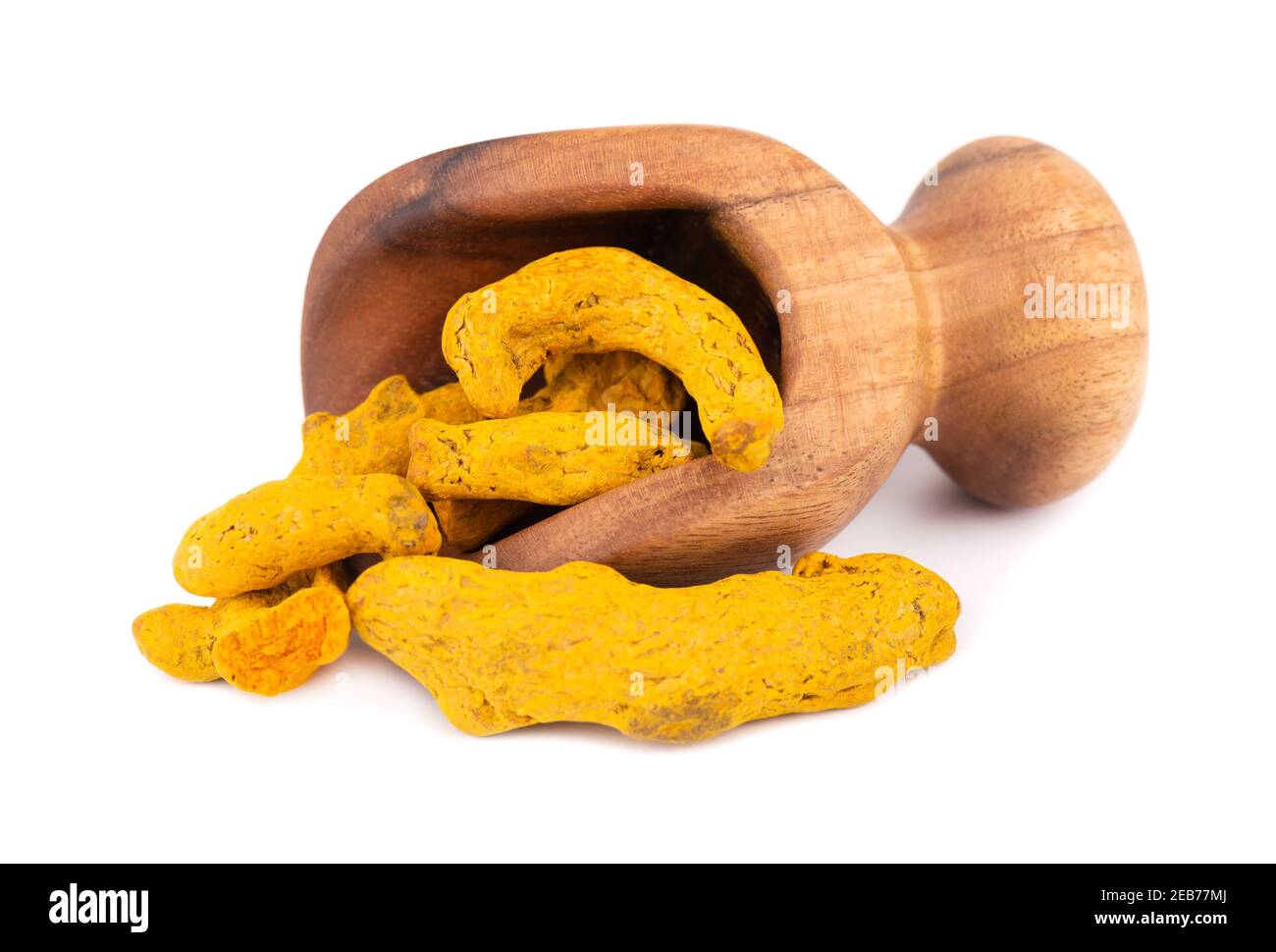 Dry turmeric root in wooden scoop, isolated on white background ...