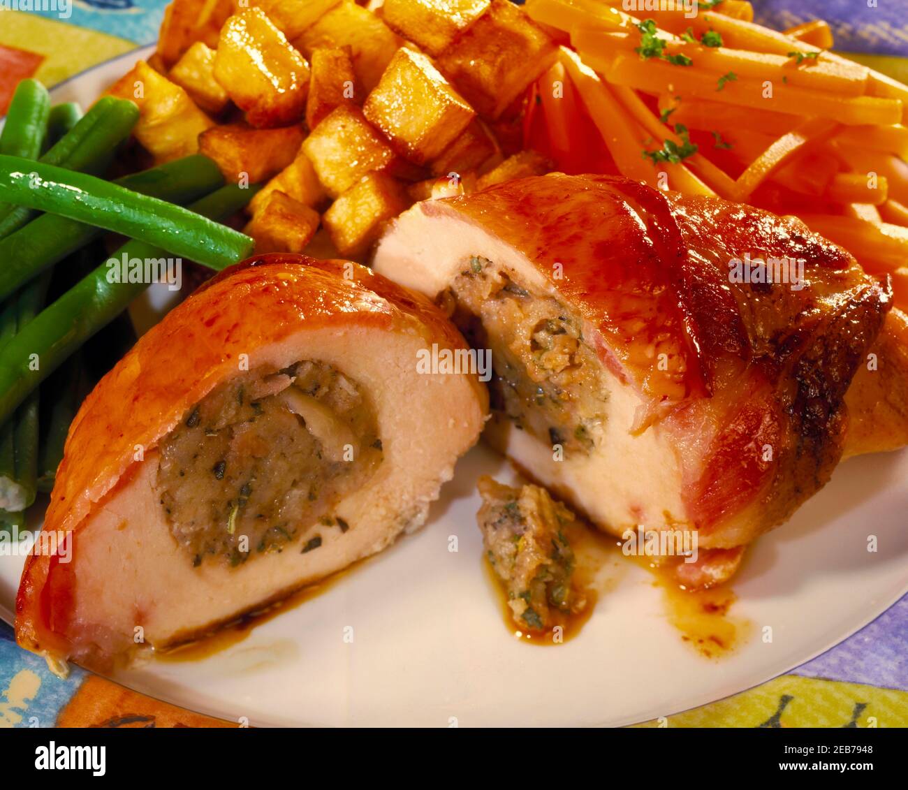Chicken with stuffing, parmentier potatoes, French beans and carrots ...