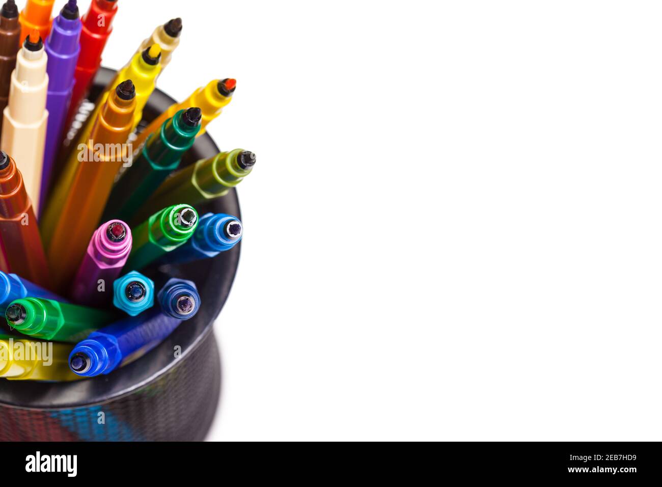 Set of markers in a cup and a piece of paper on white background Stock ...