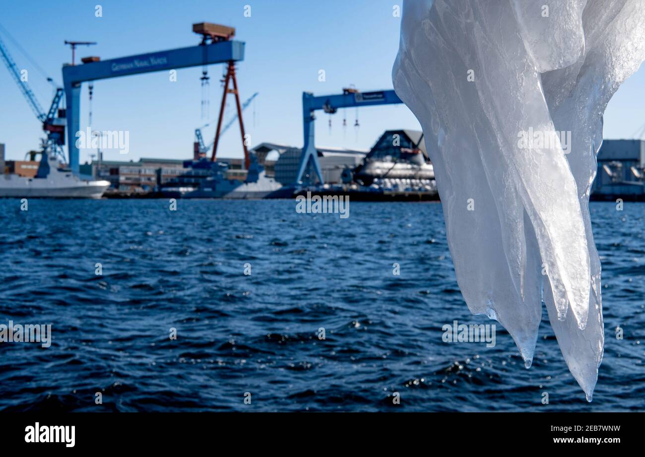 Kiel, Germany. 12th Feb, 2021. Icicles hang from a jetty on the Kiel ...