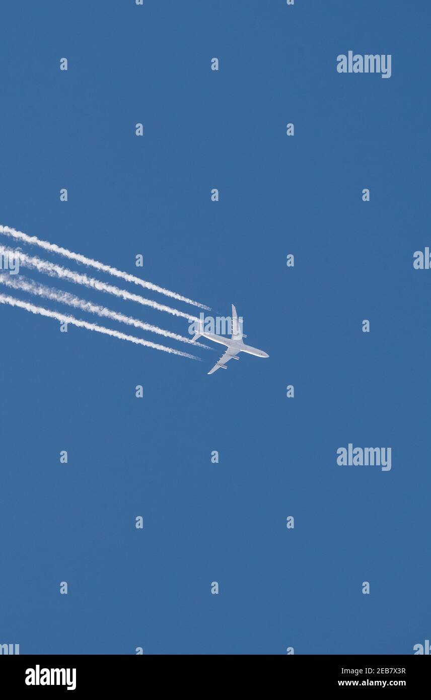 Lufthansa 4 engined Airbus cargo plane with contrail Stock Photo - Alamy